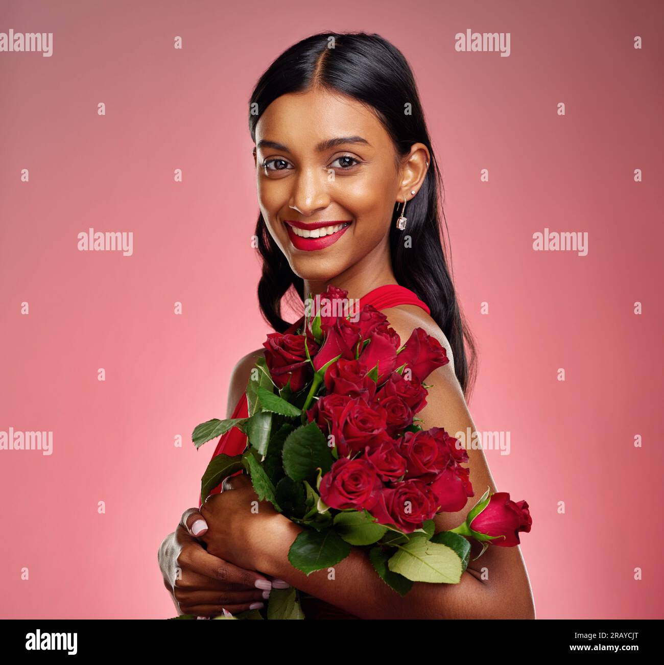 Pageant, flowers and portrait of an Indian woman on a studio background ...