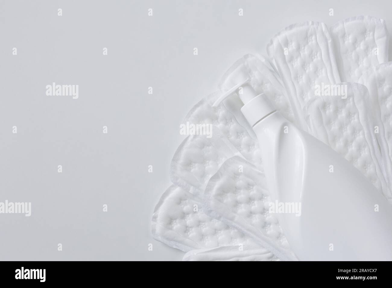 Feminine sanitary pads and liquid intimate soap on a white background ...