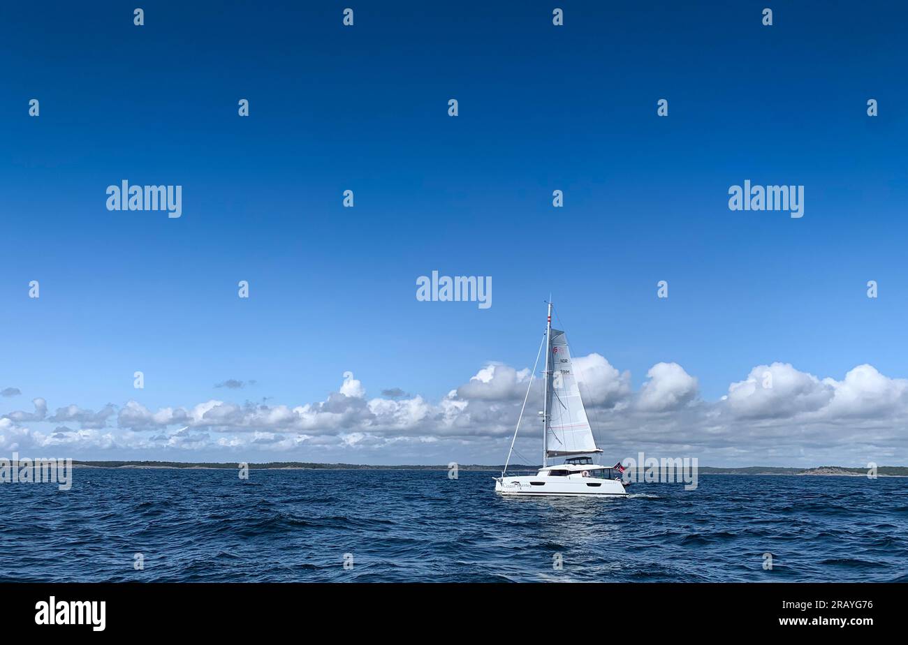 06 July 2023, Sweden, Nynäshamn: A catamaran sails across the Baltic ...