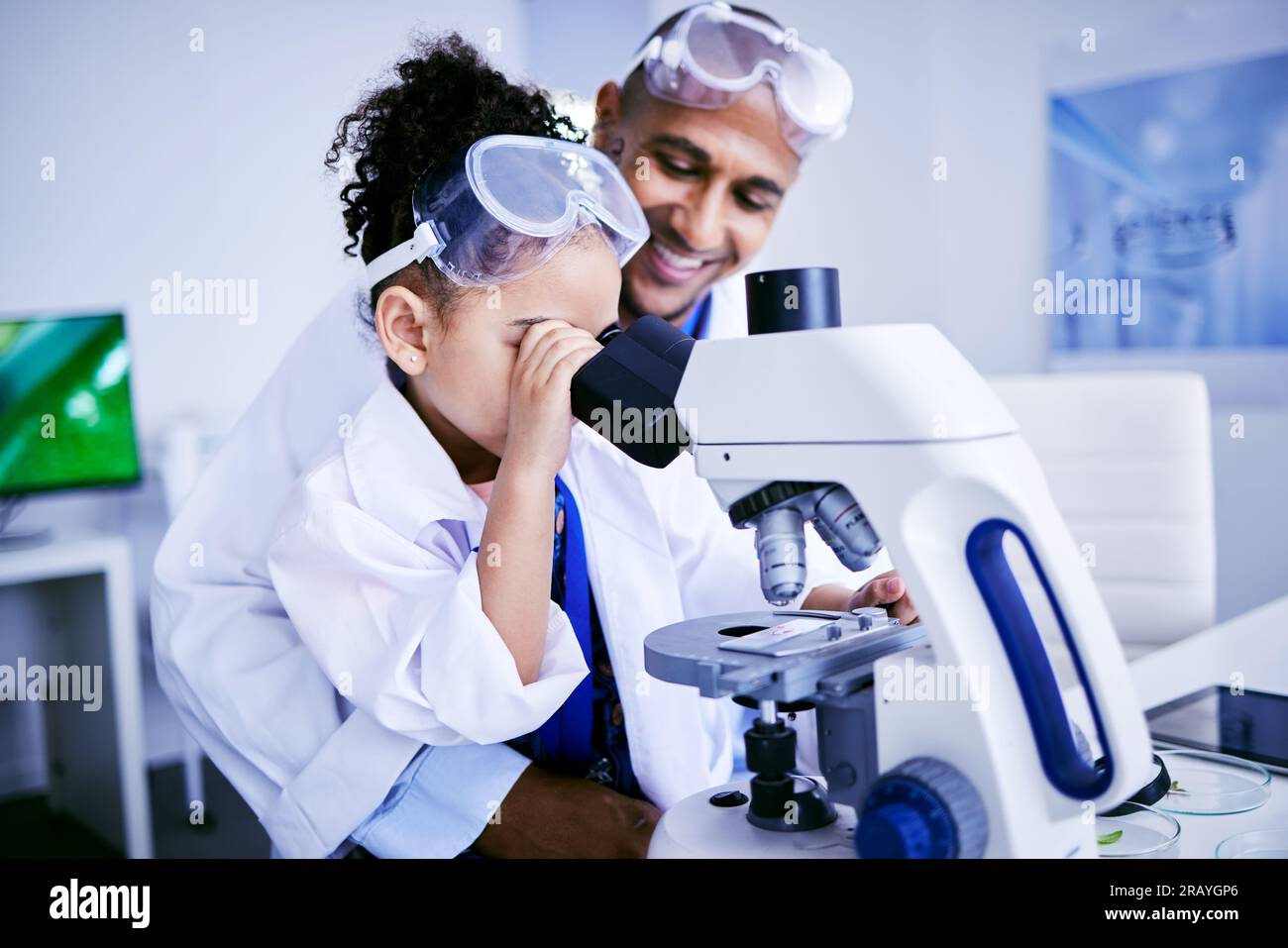 Science, microscope and dad with child in laboratory for medical ...