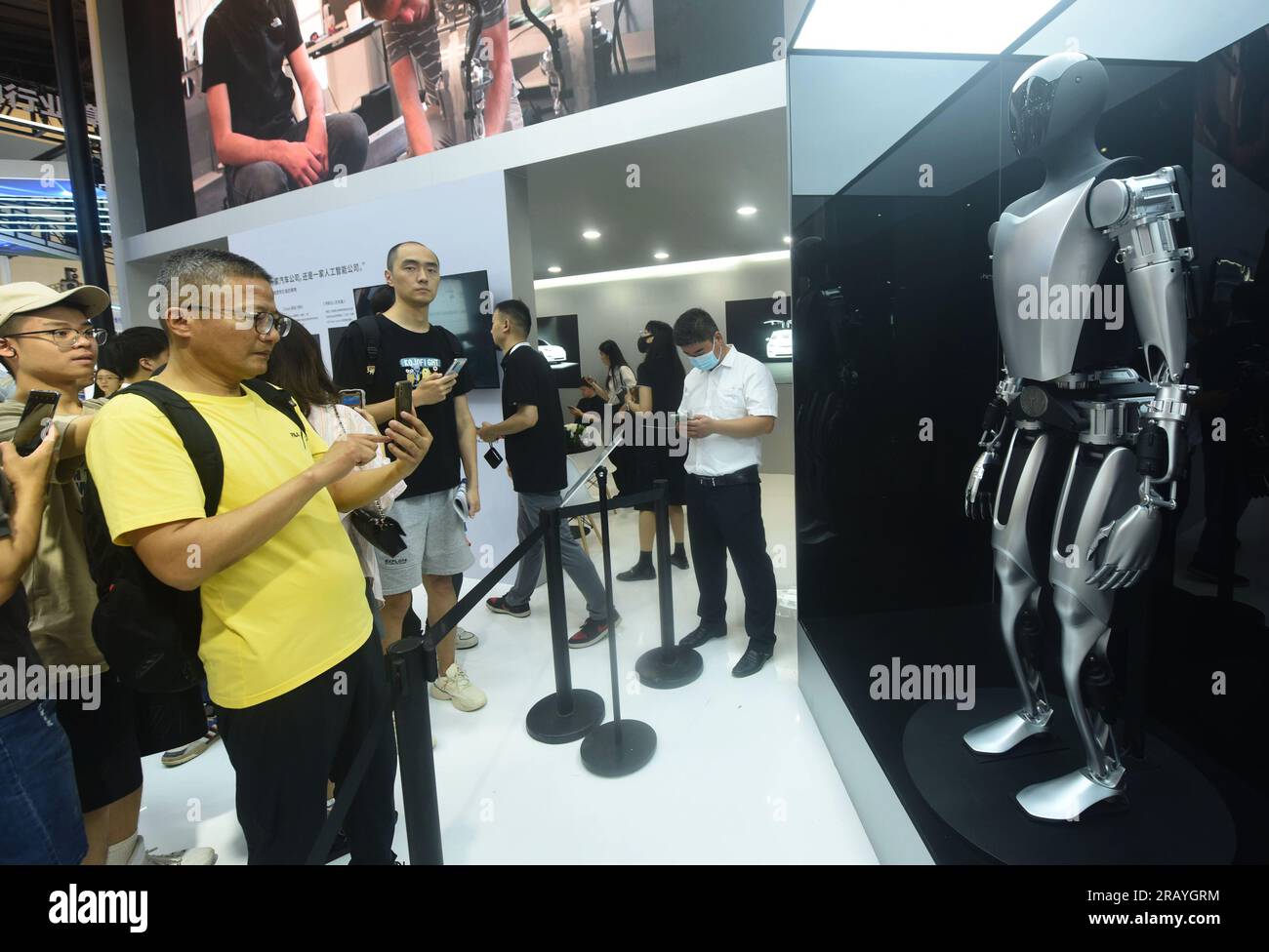 SHANGHAI, CHINA - JULY 6, 2023 - Spectators look at Tesla's "Optimus ...