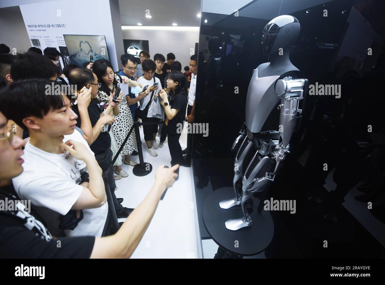 SHANGHAI, CHINA - JULY 6, 2023 - Spectators look at Tesla's "Optimus ...