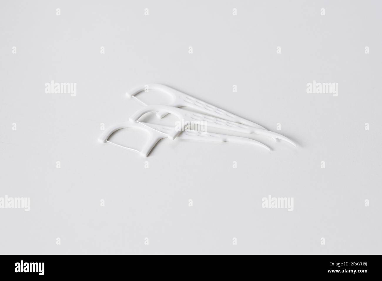 Dental toothpicks with dental floss on white background Stock Photo - Alamy