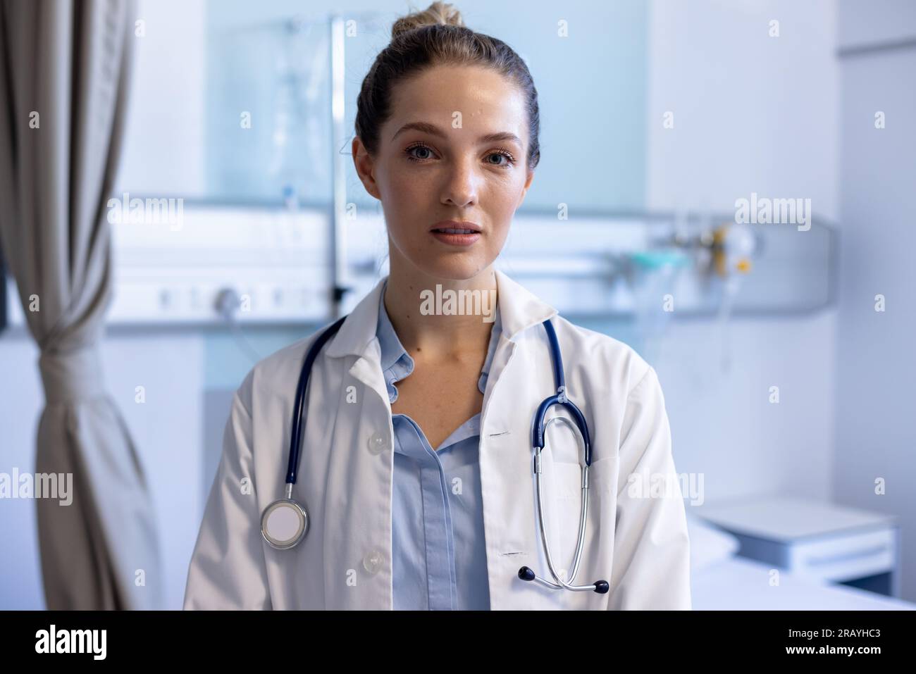 Portrait of caucasian female doctor wearing medical lab coat and ...