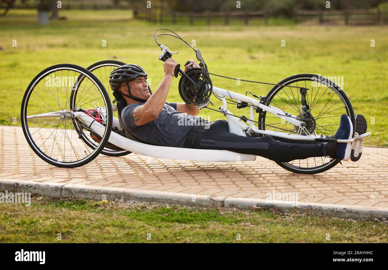 Cycling, sports and fitness with man and handcycle on road for training ...