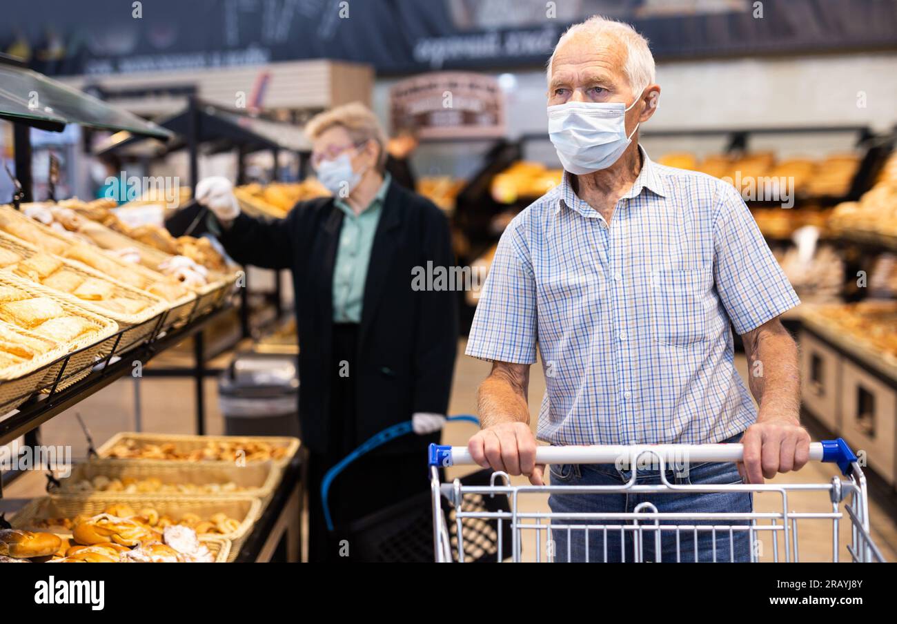 mature european man wearing mask and gloves with covid protection ...