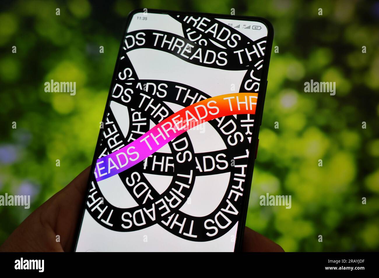 In this photo illustration, Threads logo seen displayed on a smartphone. "Threads" is Instagram ...