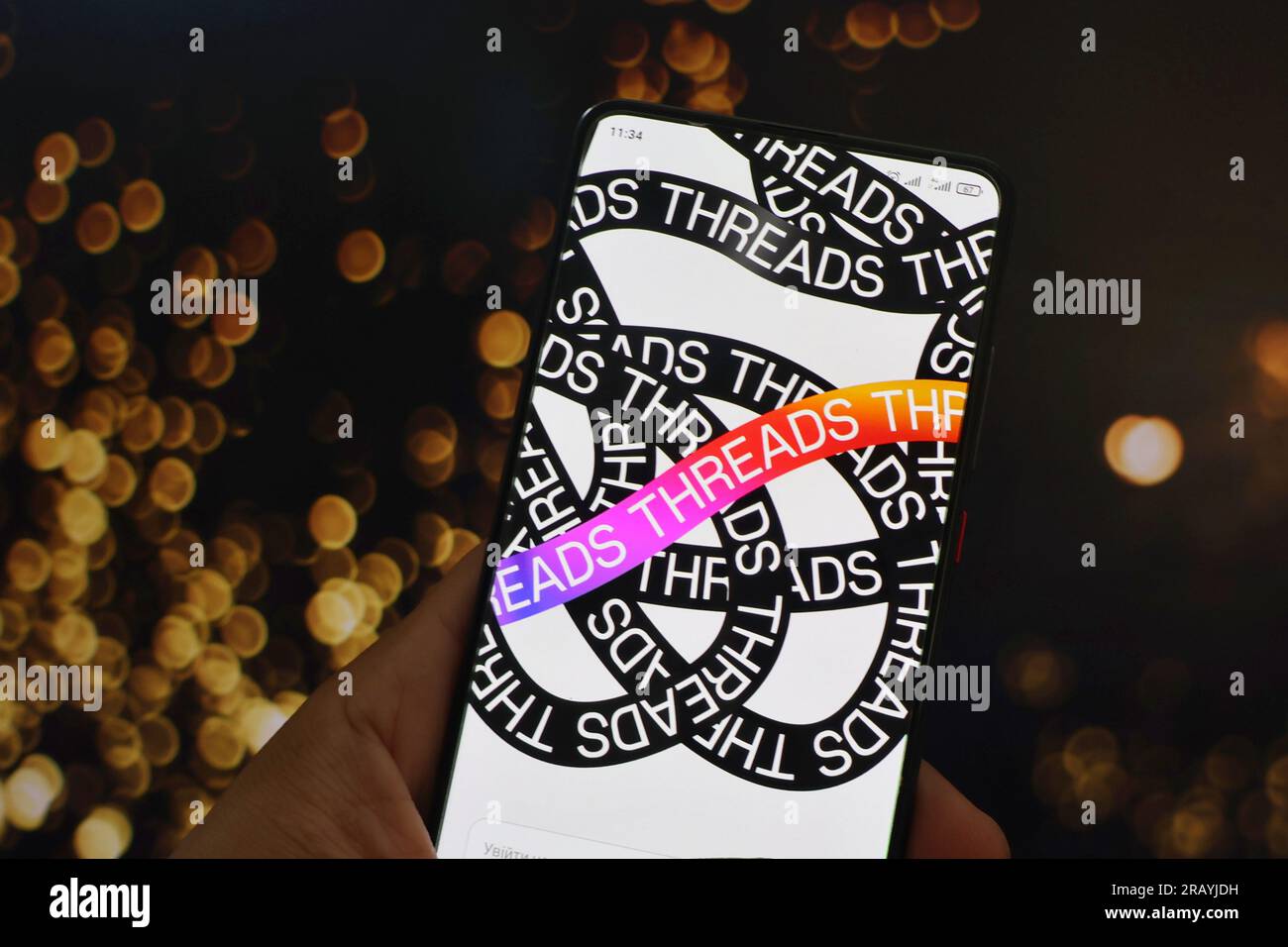 In this photo illustration, Threads logo seen displayed on a smartphone. "Threads" is Instagram ...