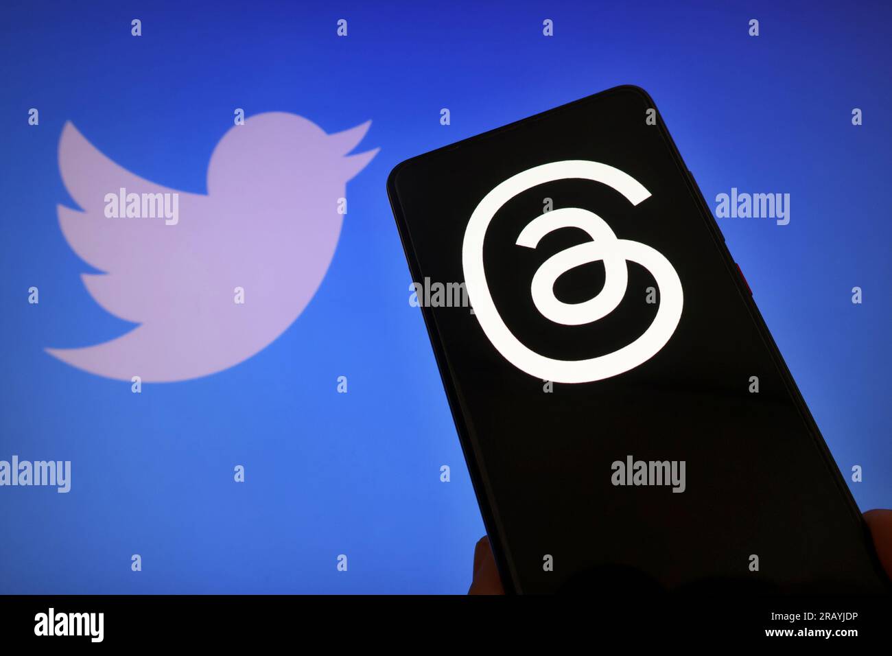 In this photo illustration, Threads logo seen displayed on a smartphone ...