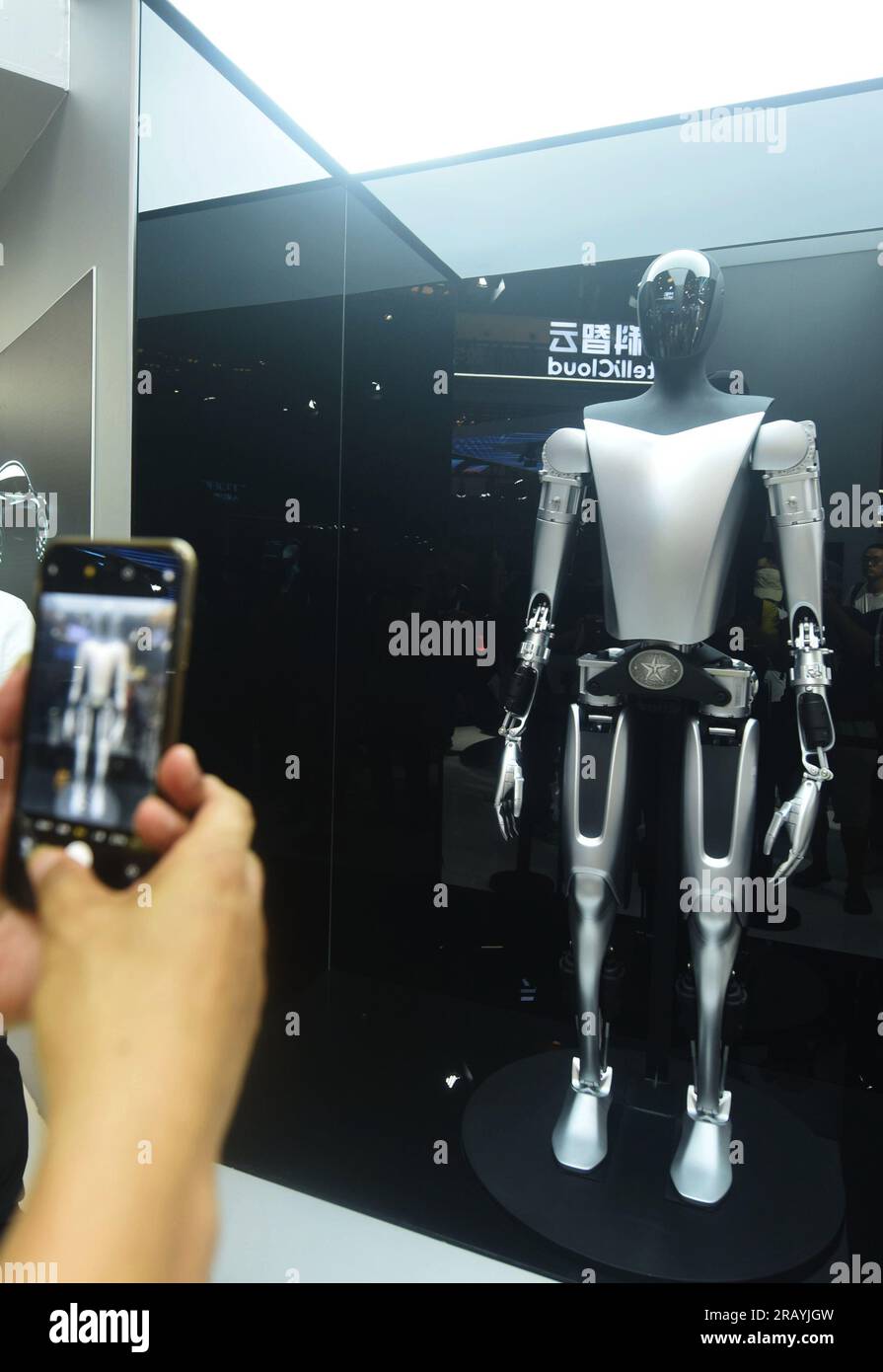 SHANGHAI, CHINA - JULY 6, 2023 - Spectators look at Tesla's "Optimus ...