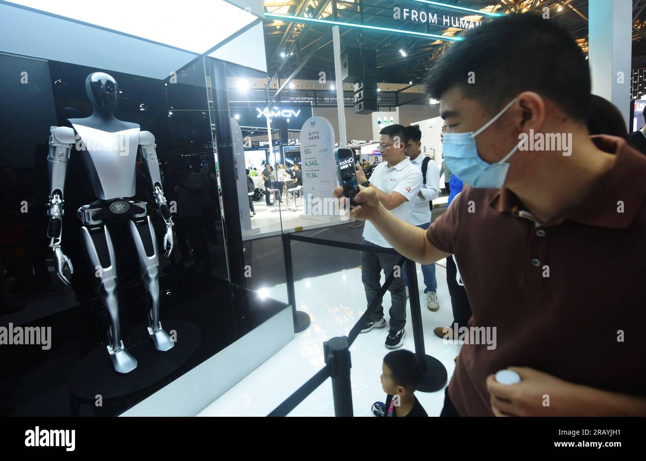 SHANGHAI, CHINA - JULY 6, 2023 - Spectators look at Tesla's "Optimus ...