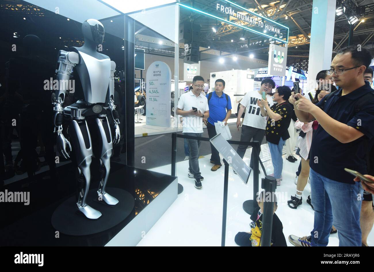 SHANGHAI, CHINA - JULY 6, 2023 - Spectators look at Tesla's "Optimus ...