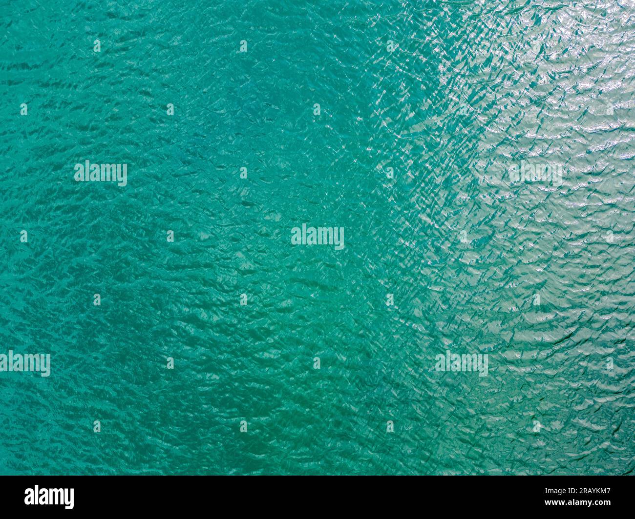 Aerial view of a crystal clear sea water texture. View from above ...