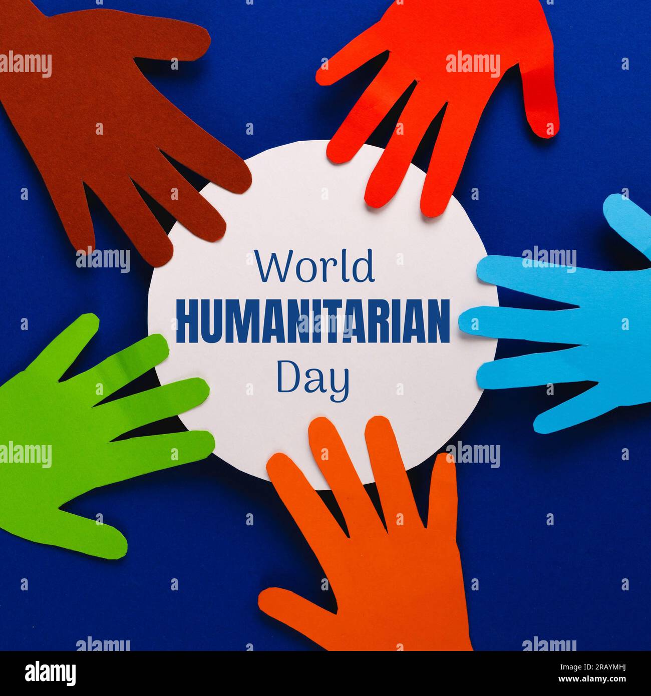 World humanitarian day text on white circle with multi coloured hands ...