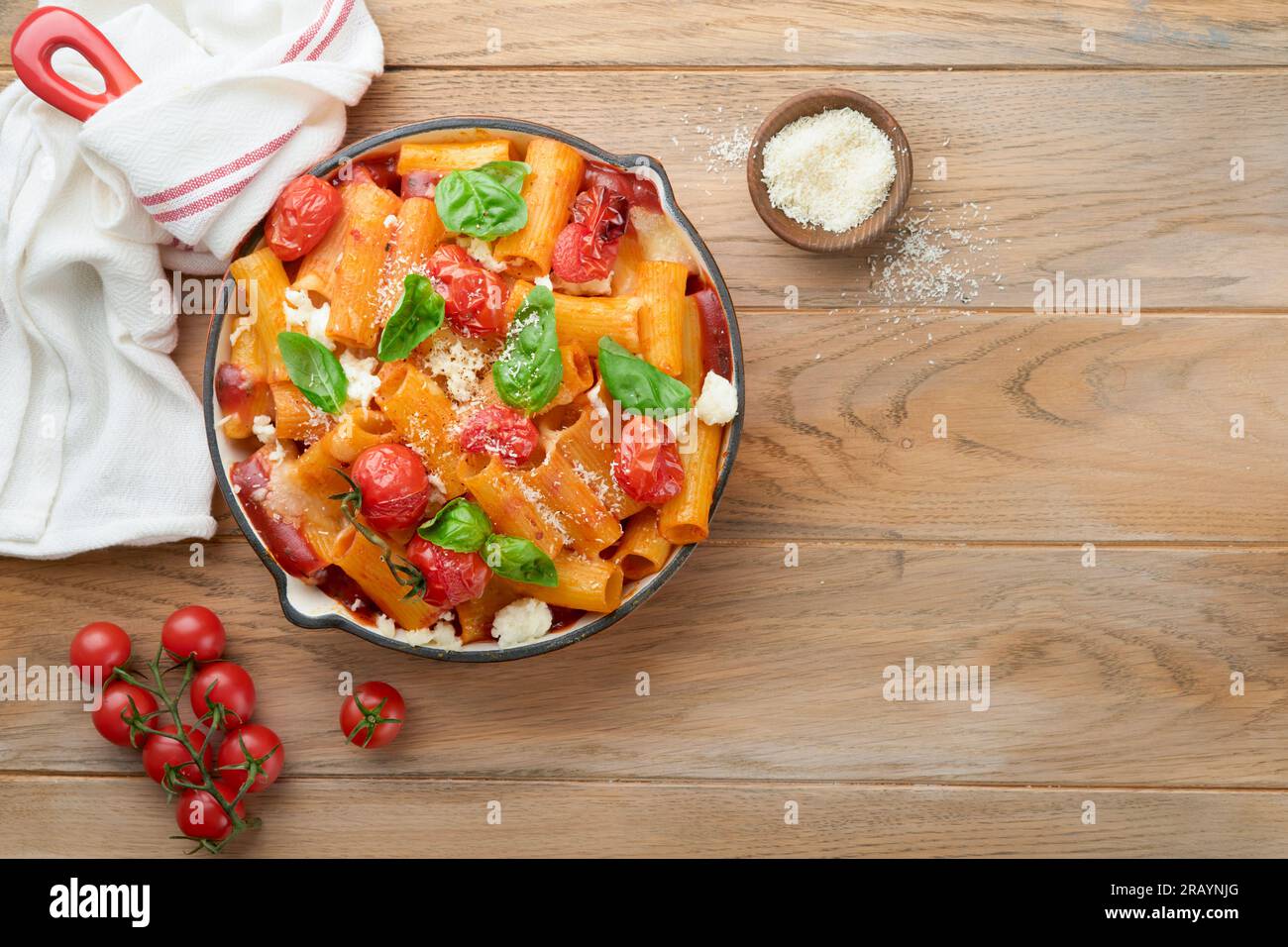 Pasta Tortiglioni with tomato sauce, baked cherry tomatoes, mozzarella ...