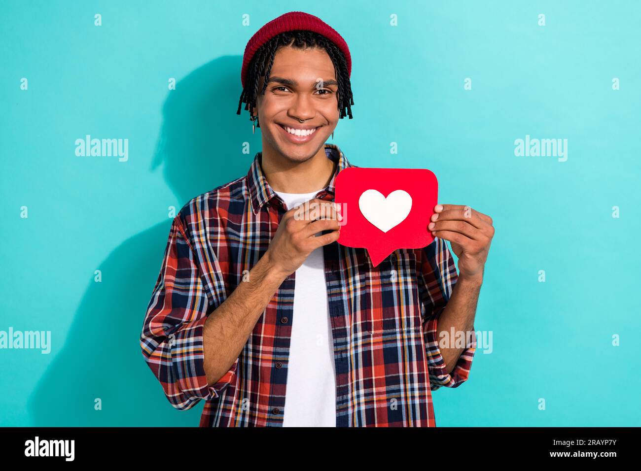 Photo of satisfied handsome pleasant guy with dreadlocks wear plaid ...