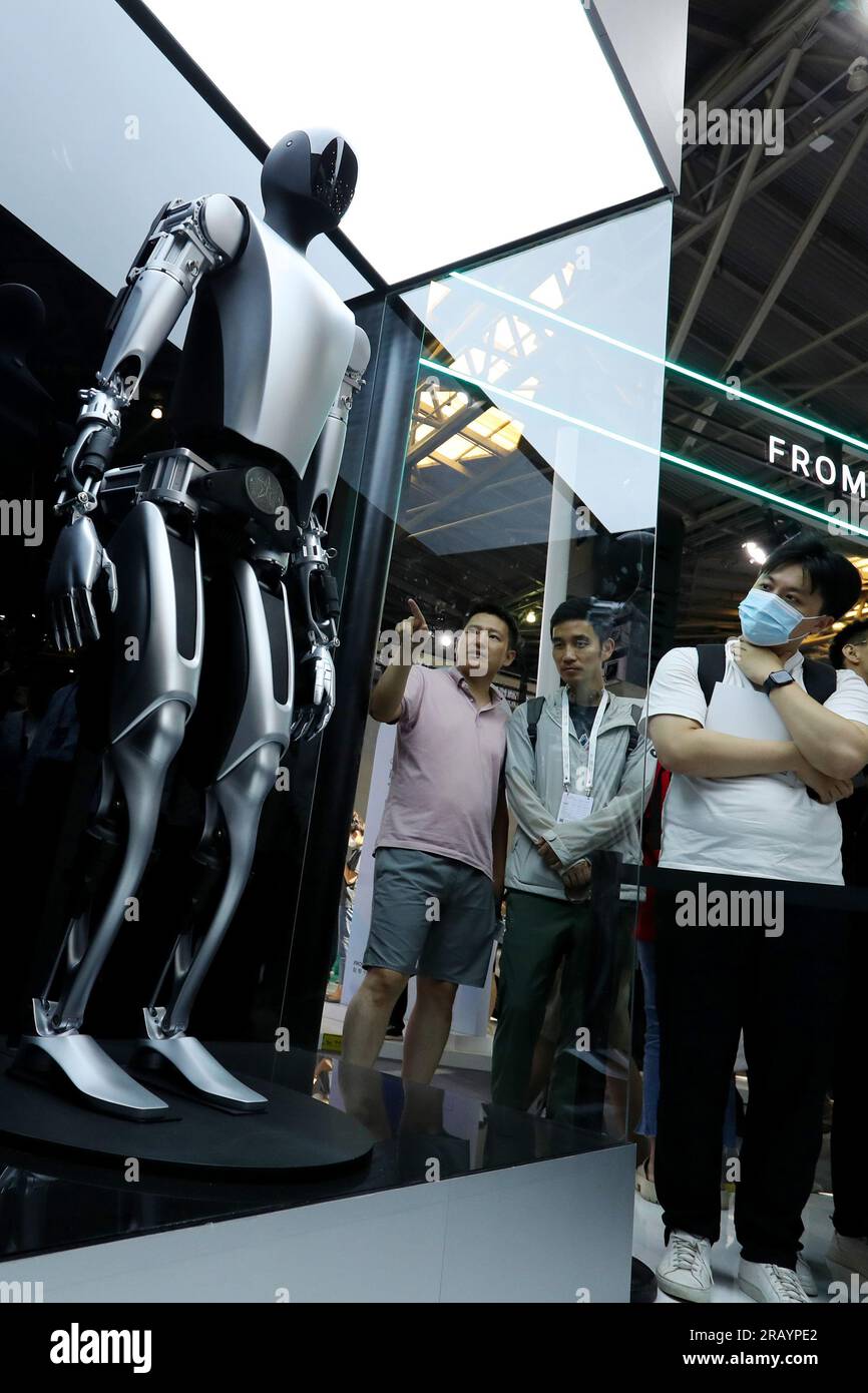 Shanghai, China. 6th July, 2023. Visitors watch a robot from Tesla ...