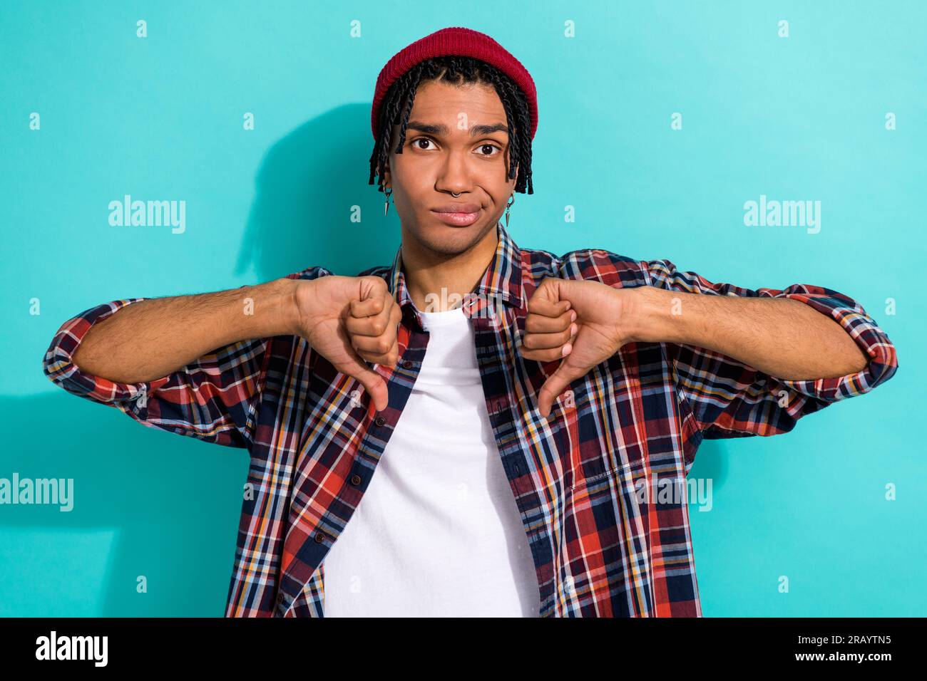 Photo of dissatisfied disappointed guy with dreadlocks wear plaid shirt ...