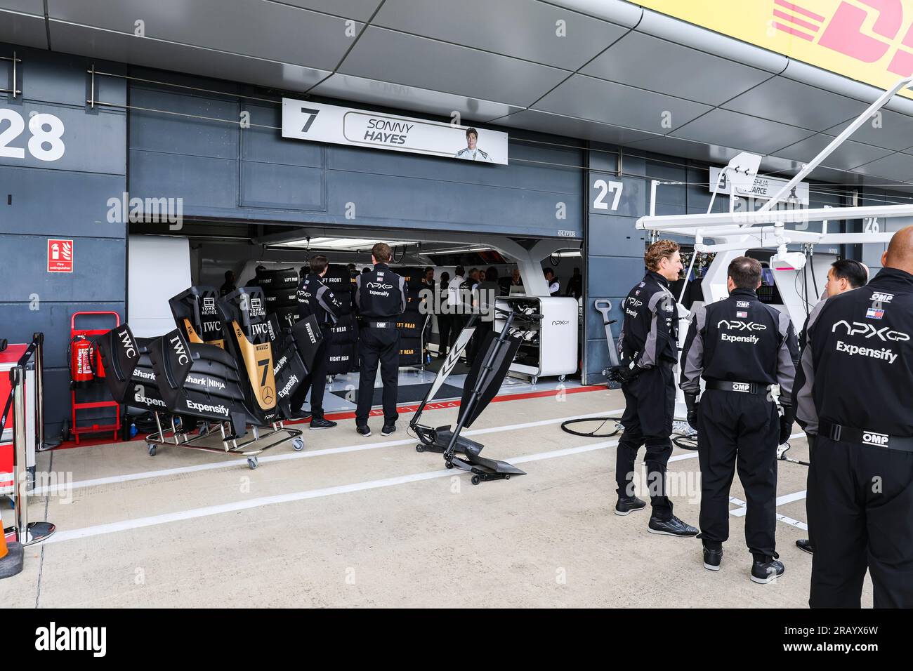 APEX APXGP Team crew in the pitlane for the F1 movie by Apple Studios ...