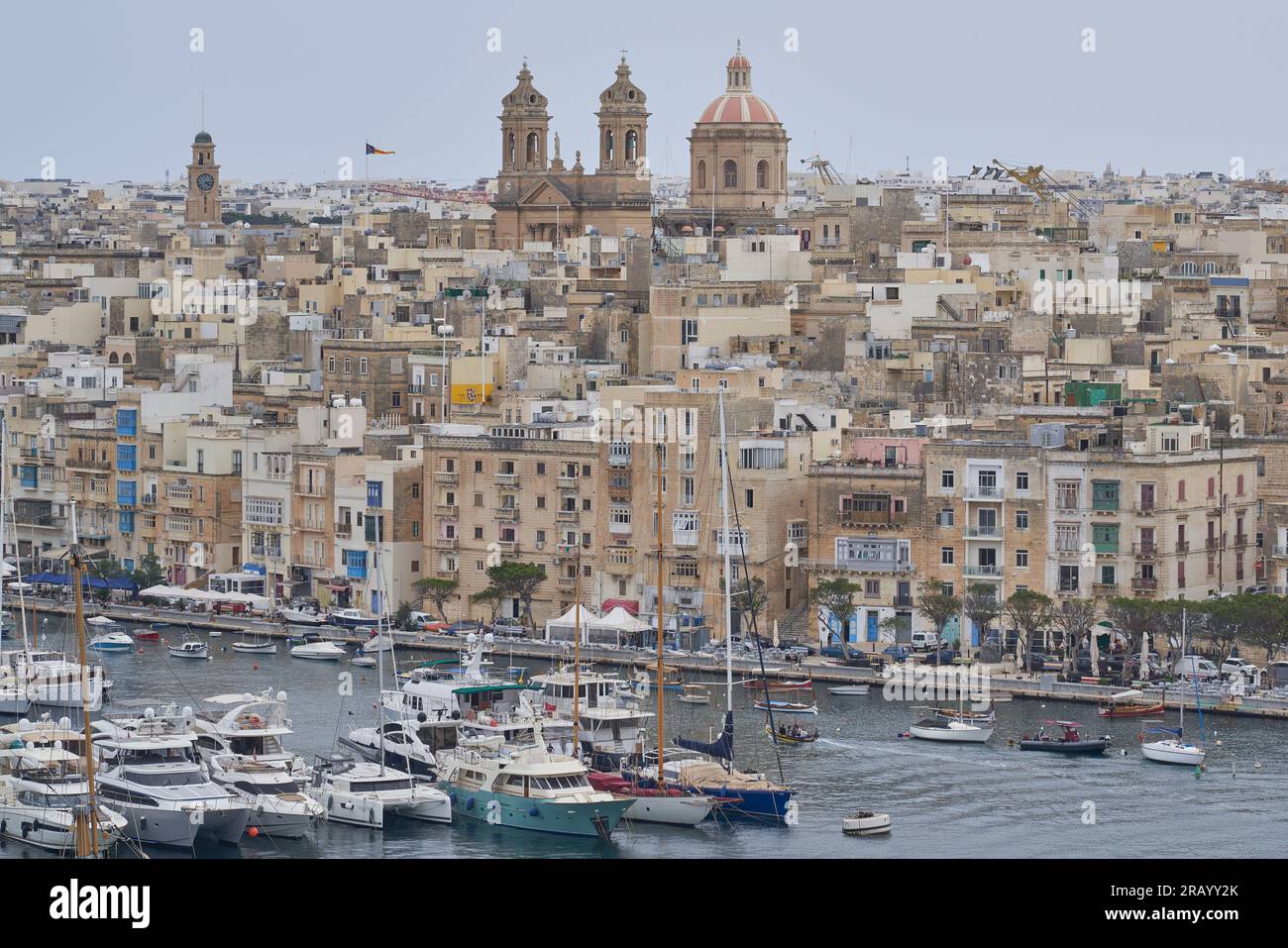 Luxury boats moored alongside Fort Saint Angelo in Grand Harbour ...