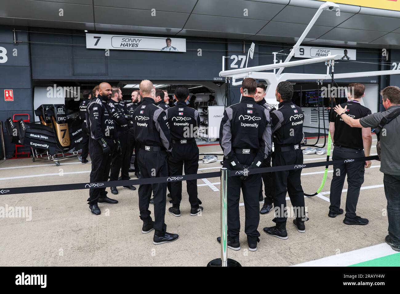 APEX APXGP Team crew in the garage for the F1 movie by Apple Studios ...