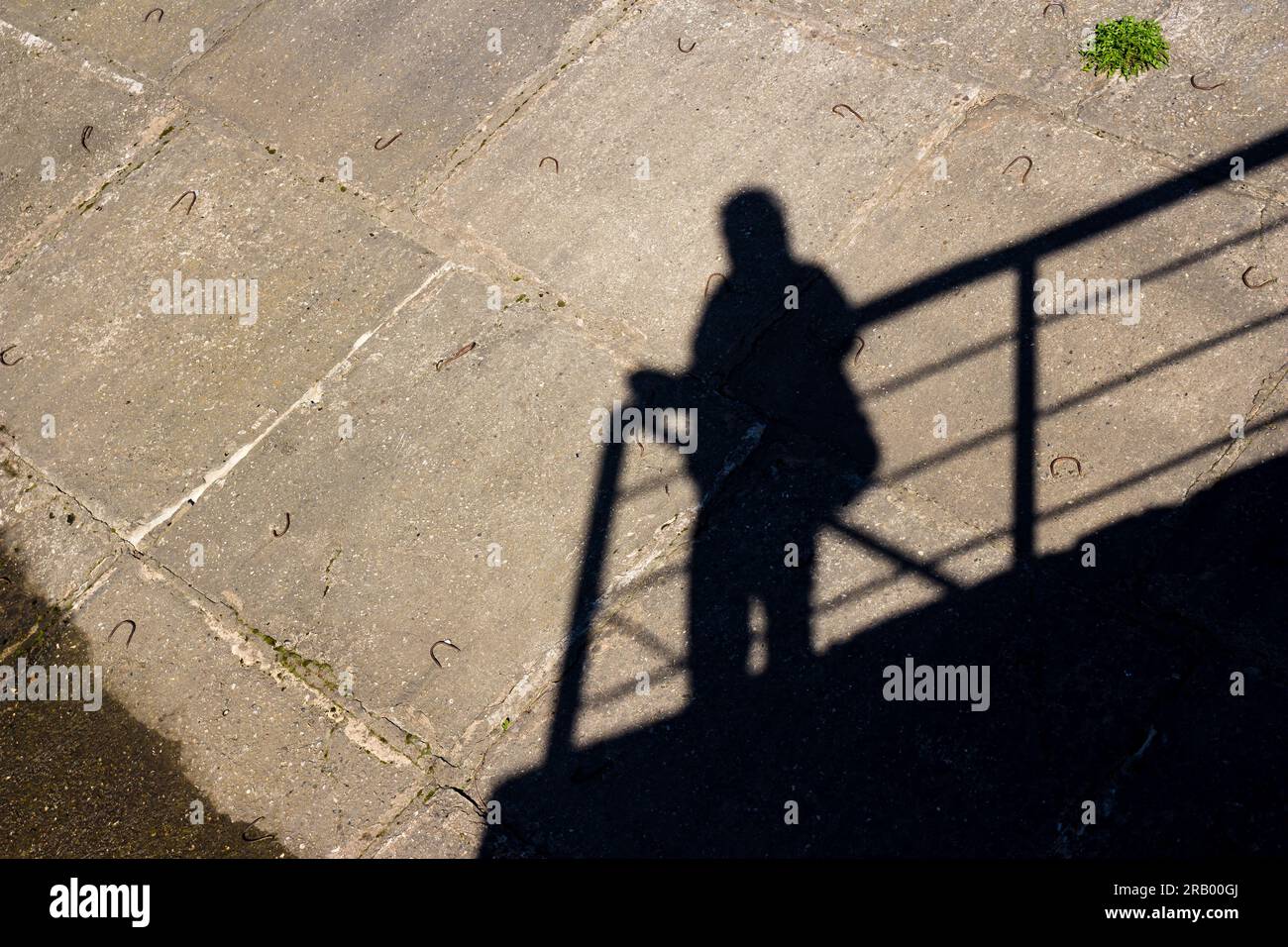 Shadow of a man standing at the railing, black silhouette Stock Photo ...