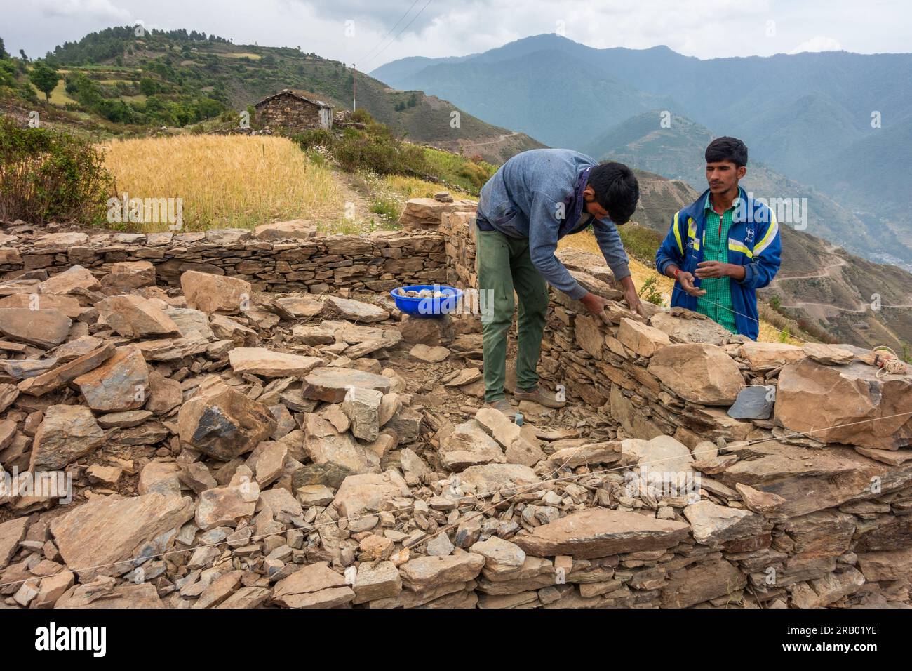 June 28th 2023,Nagthat, Uttarakhand, India. Local workers constructing ...