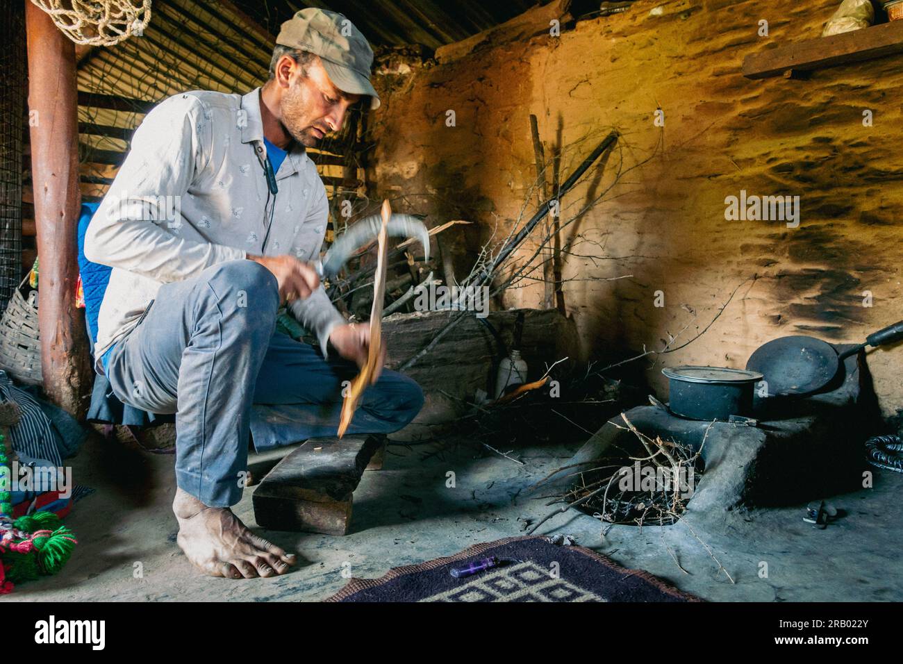 June 28th, 2023, Nagthat, Uttarakhand, India. A man preparing firewood ...