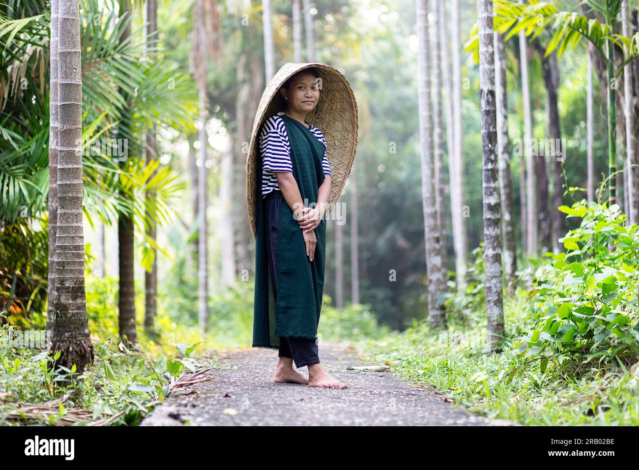 Woman from Khasi tribe with traditional bamboo hat on her head ...