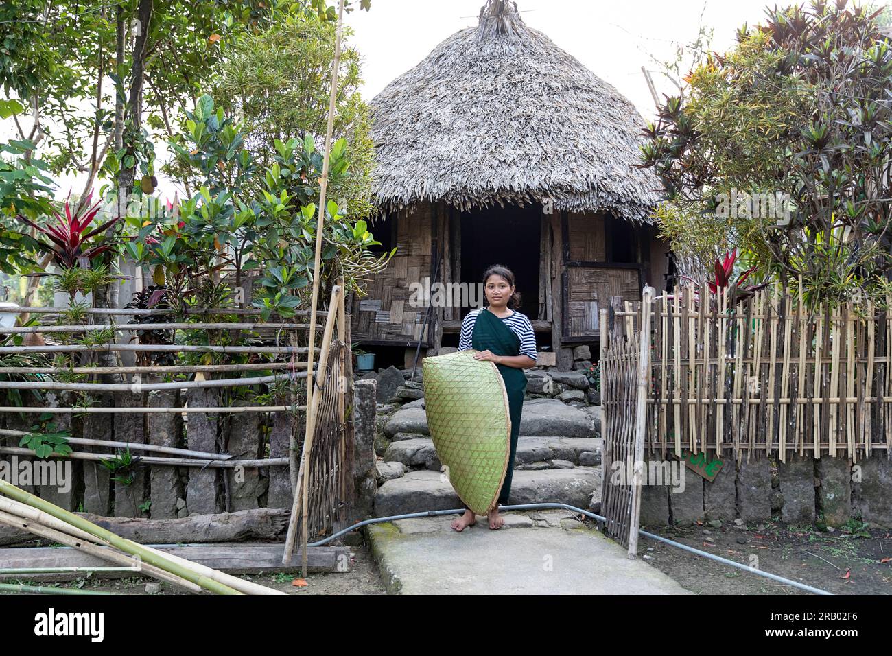 Girl from khasi tribe in traditional clothes wearing traditional rain ...