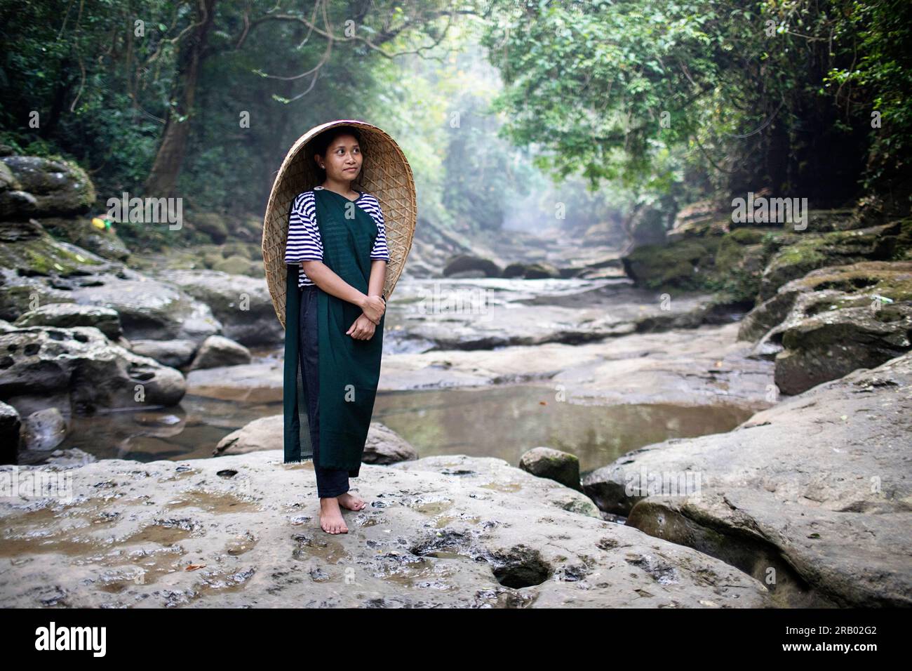 Local woman from Khasi tribe with traditional bamboo hat on her head ...