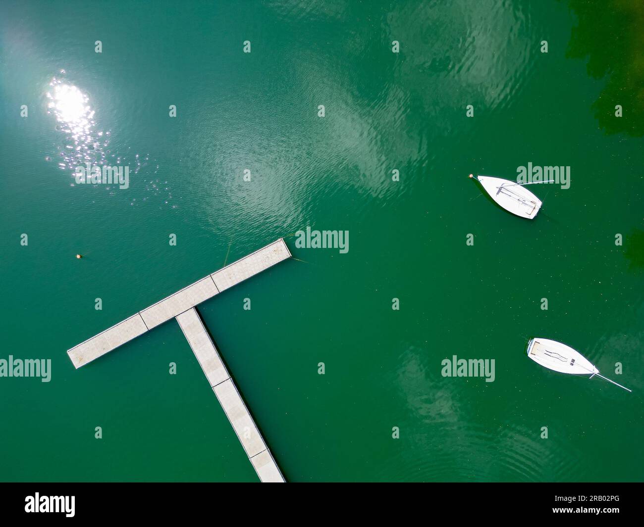 An engaging aerial top-down view that showcases a collection of docked ...