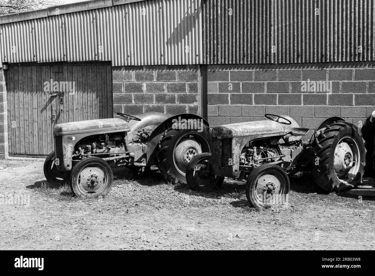 Old tractors outside on a working farm, black and white picture Stock ...