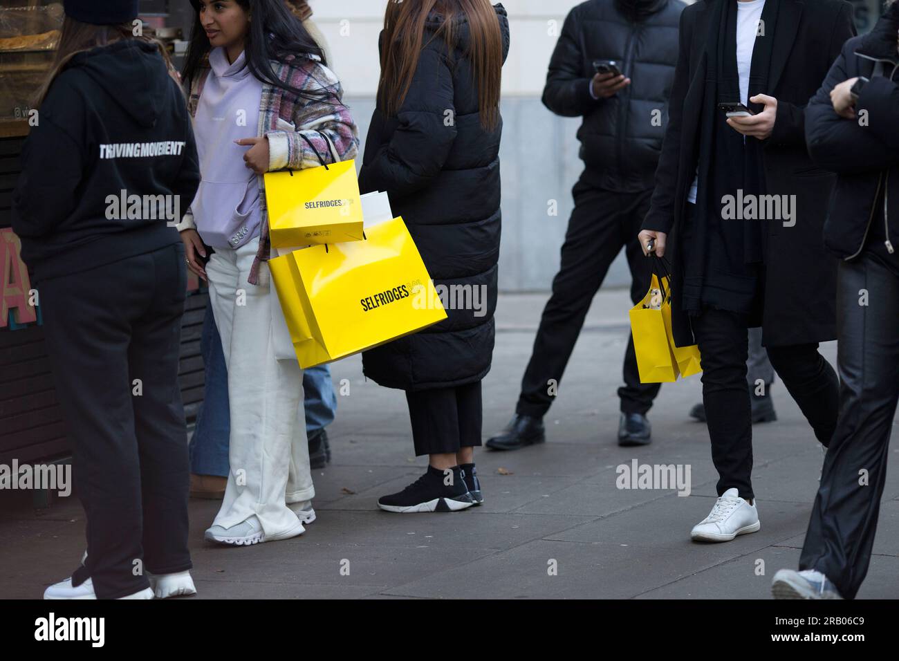 Shoppers walk on Oxford Street in central London Stock Photo - Alamy