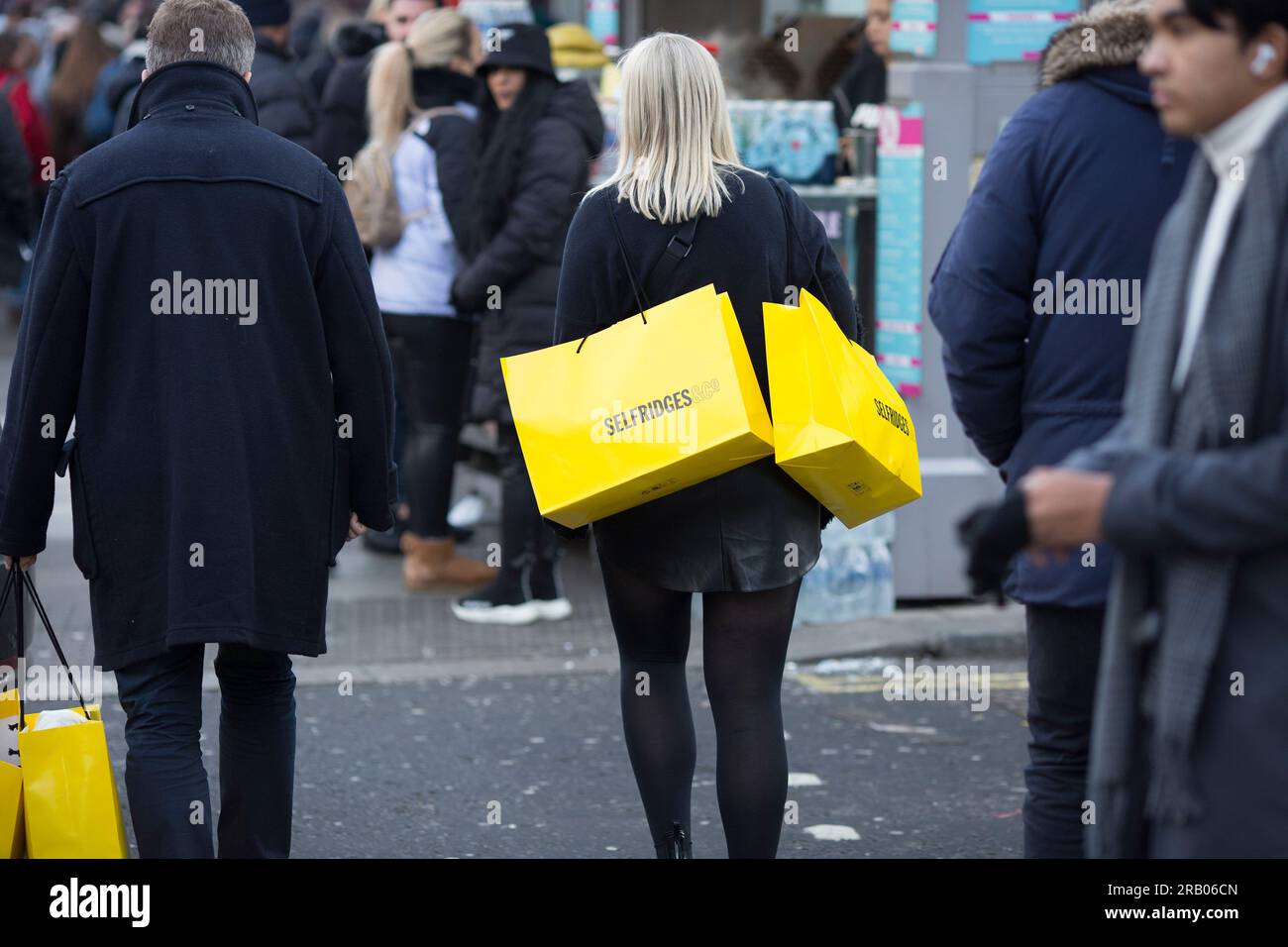 Shoppers walk on Oxford Street in central London Stock Photo - Alamy