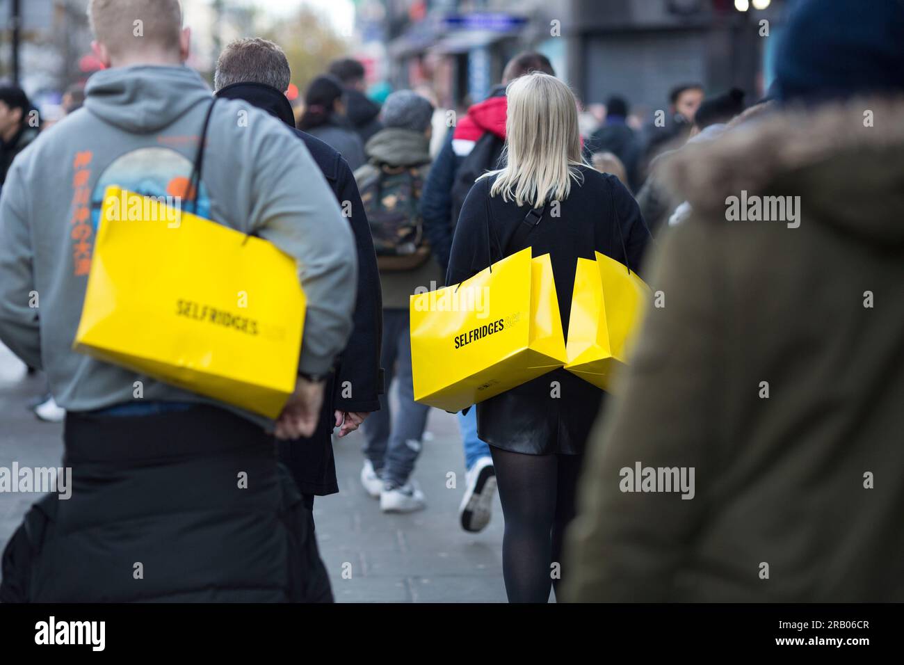 Shoppers walk on Oxford Street in central London Stock Photo - Alamy