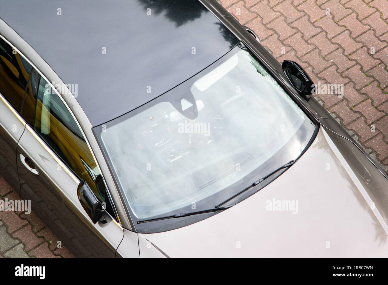 Windscreen with a detail of rain sensor for automatic wipers on a car ...