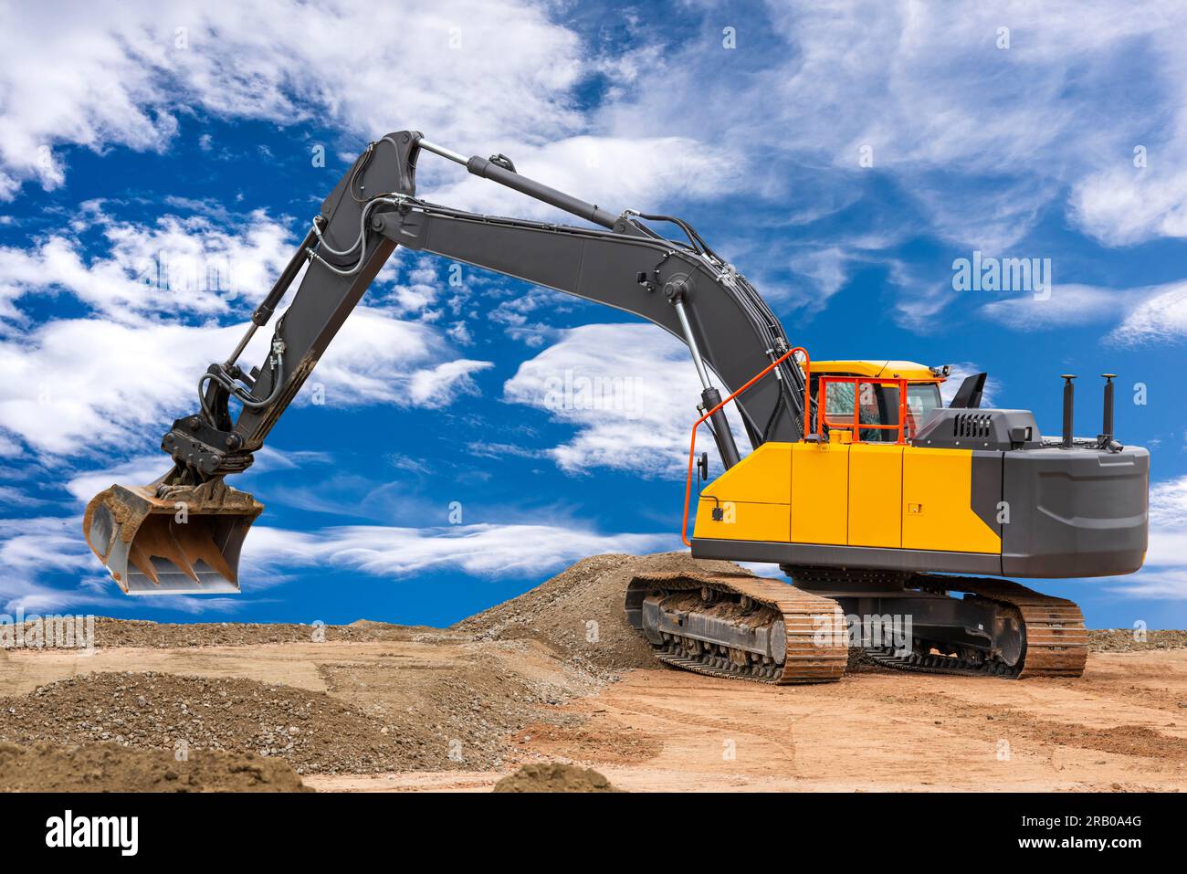 excavator is working and digging at construction site Stock Photo - Alamy