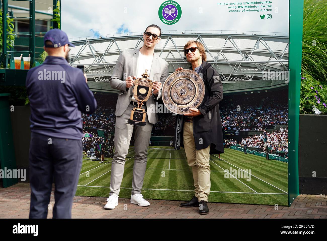 Spectators pose for pictures with replica Gentlemen’s and Ladie’s ...