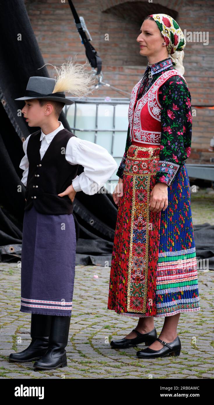 A boy in Traditional costume dancing at a cultural festival in ...