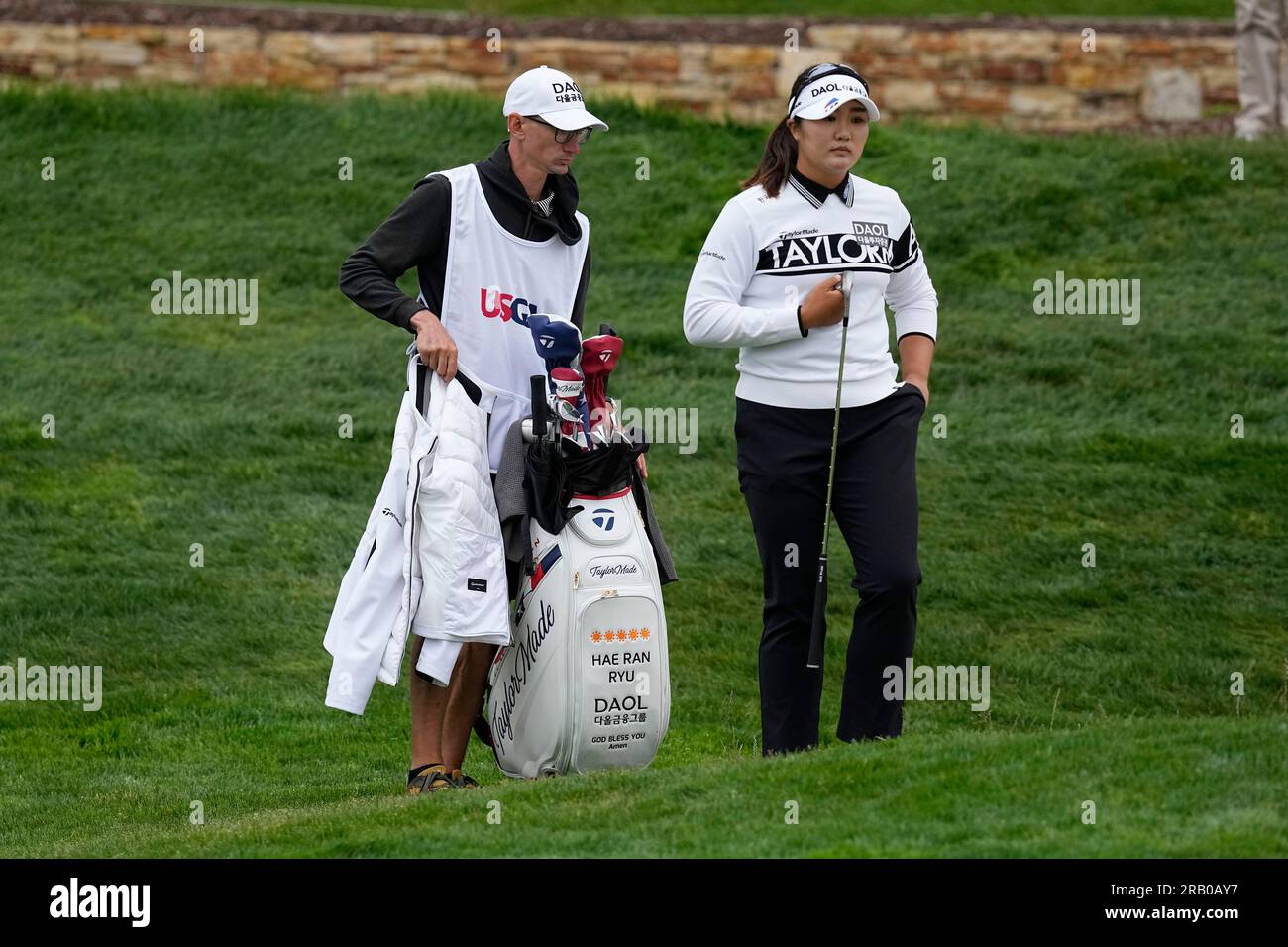 Hae Ran Ryu, right, walks with her caddie on the third hole during the ...