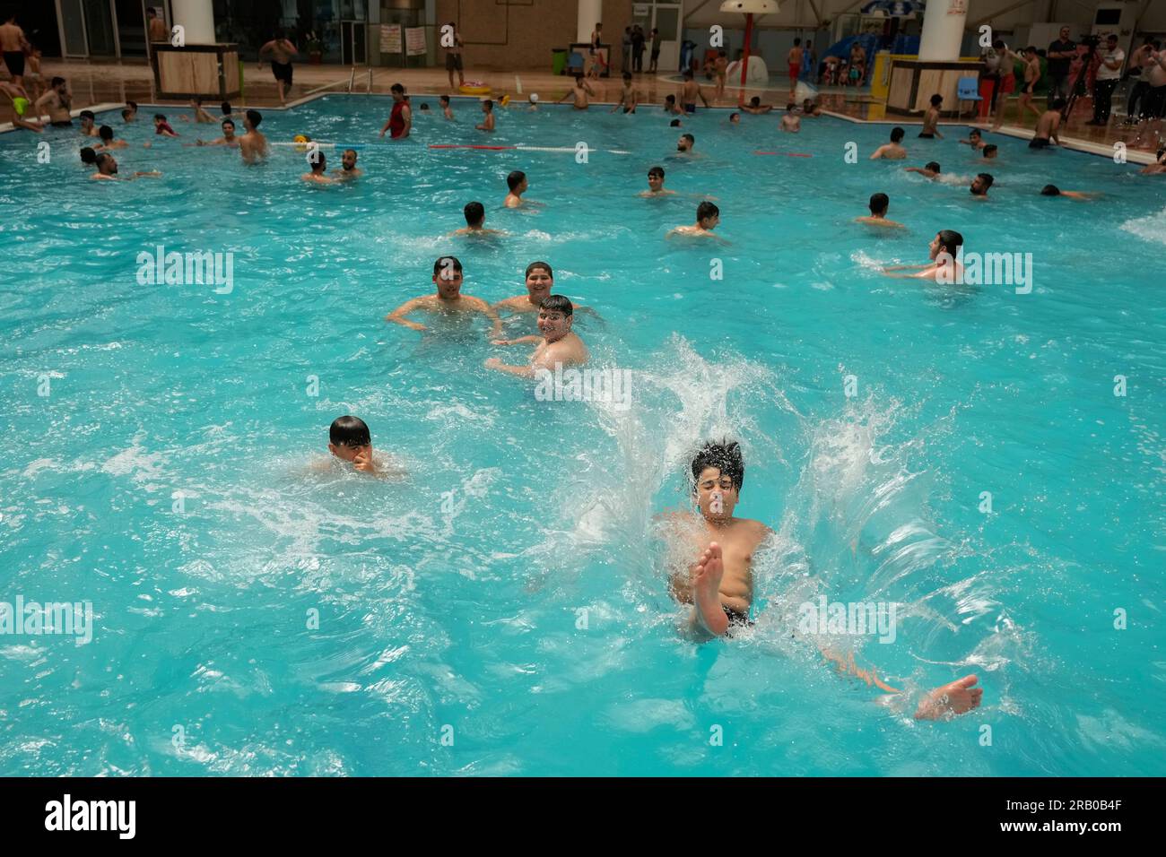 People escape the searing summer heat at Baghdad Aquatic Center in ...