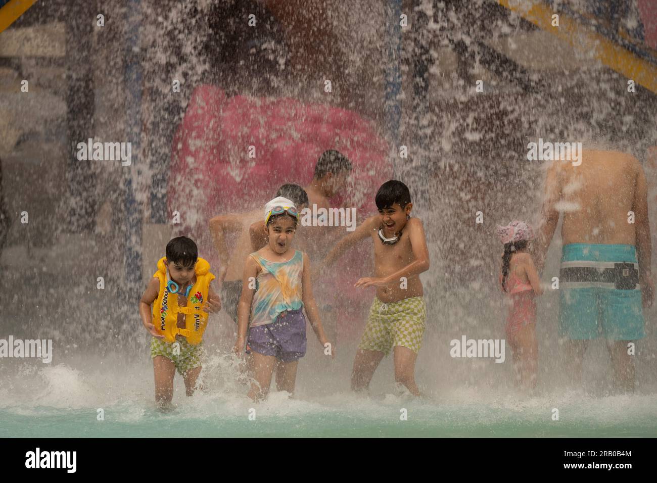People escape the searing summer heat at Baghdad Aquatic Center in ...