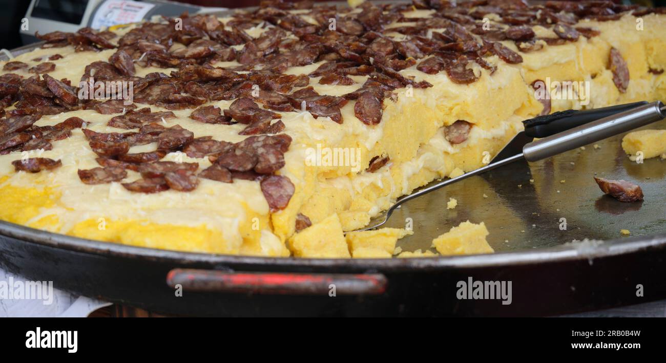 Traditional Romanian dish made from potatoes and sausage Stock Photo ...