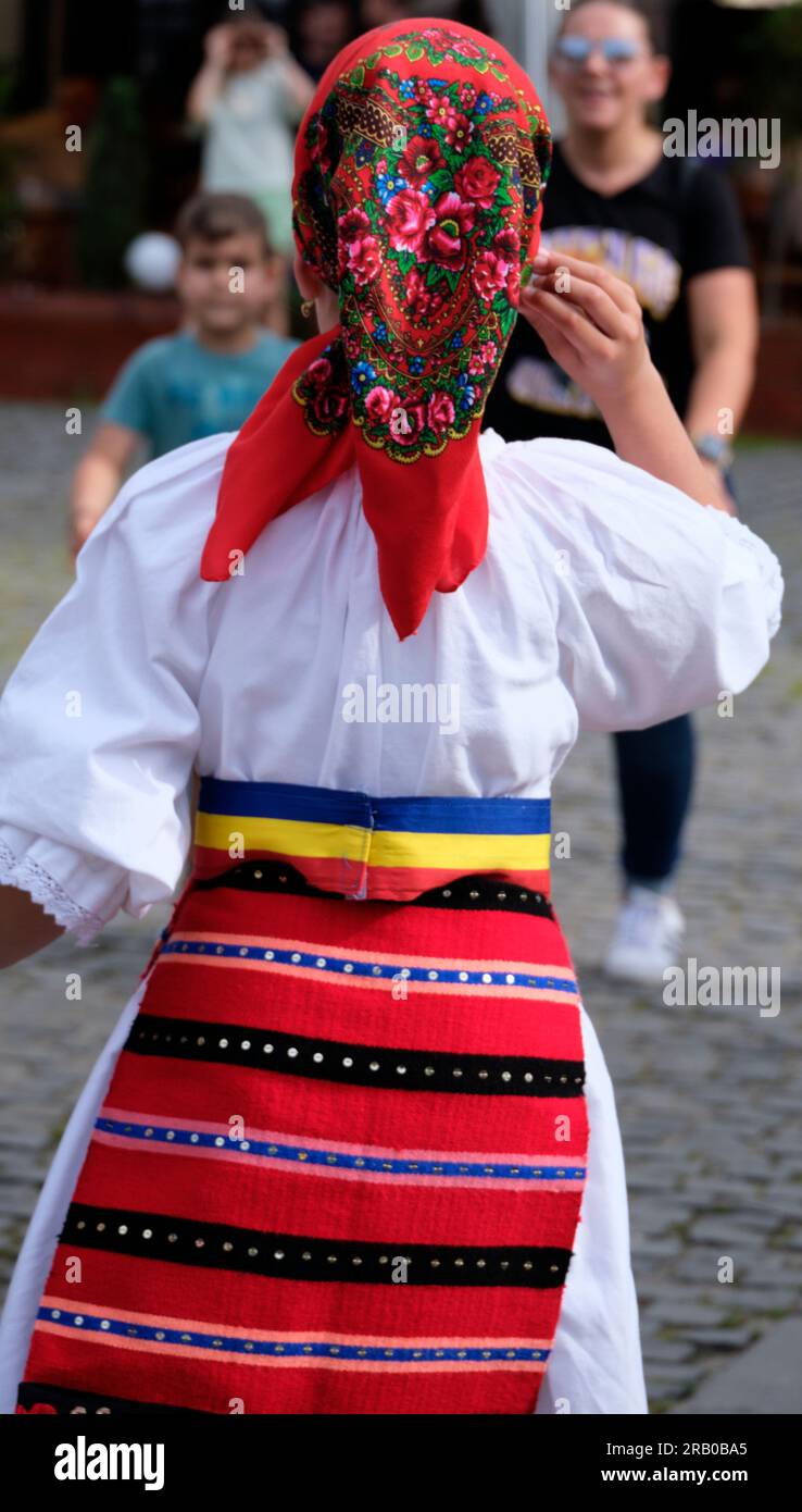 A girl in Traditional dress at a cultural festival in Transylvania ...