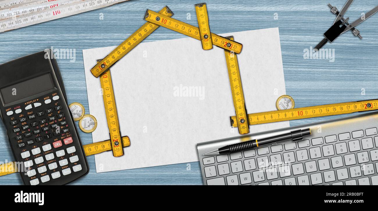 Folding wooden ruler in the shape of a house on a desk with blank sheet ...