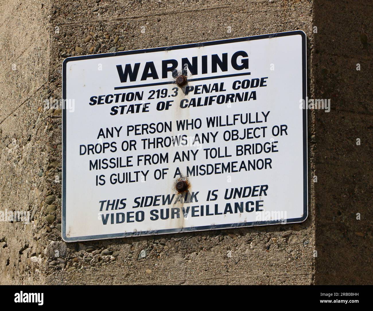 Warning sign not to throw anything from a toll bridge sidewalk under ...