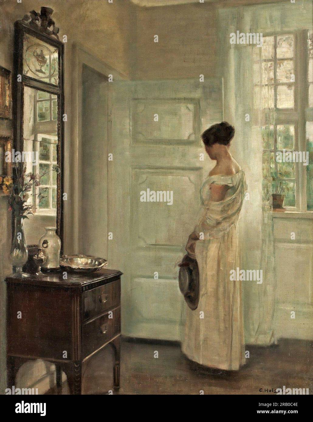 Woman in an Interior with a Mirror 1898 by Carl Holsøe Stock Photo - Alamy