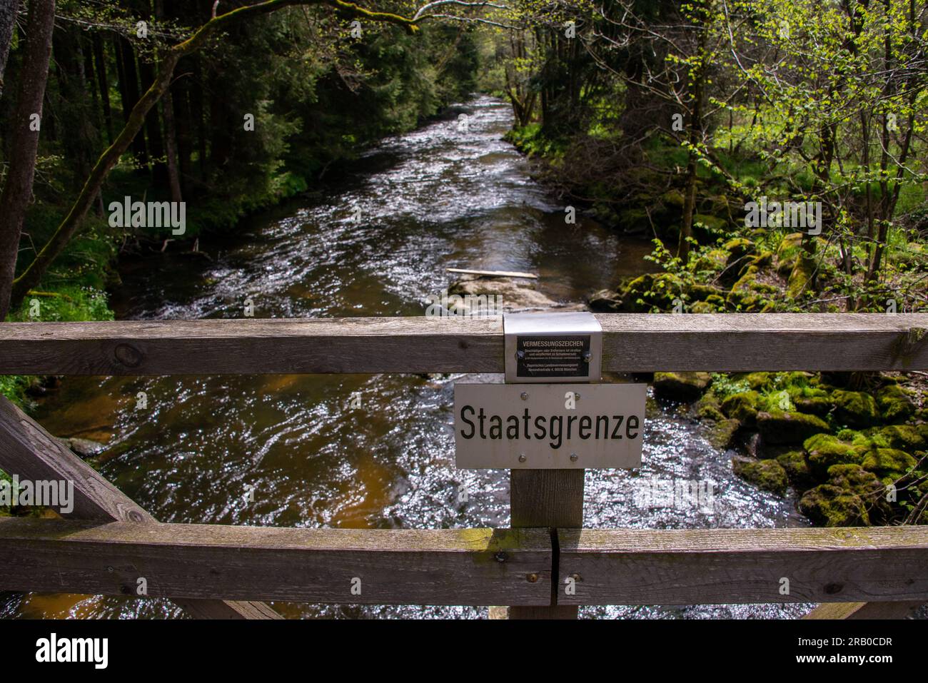 State Border! Sign on a hiking trail at the Austro-German border on a ...