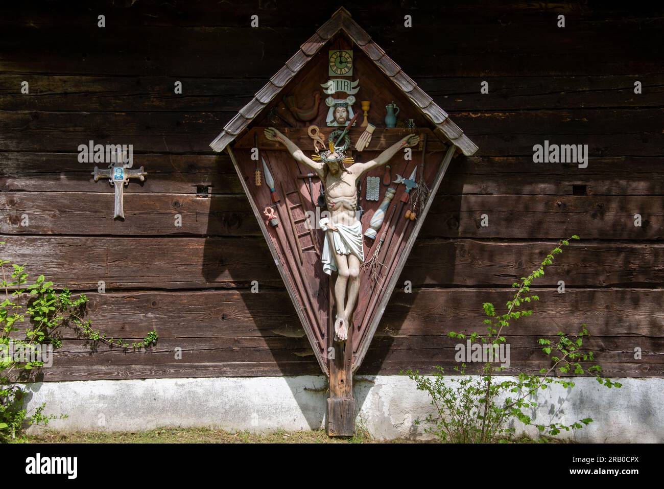 A historic crucifix on the wall of a historic granary on site of the weavers and farmhouse ...